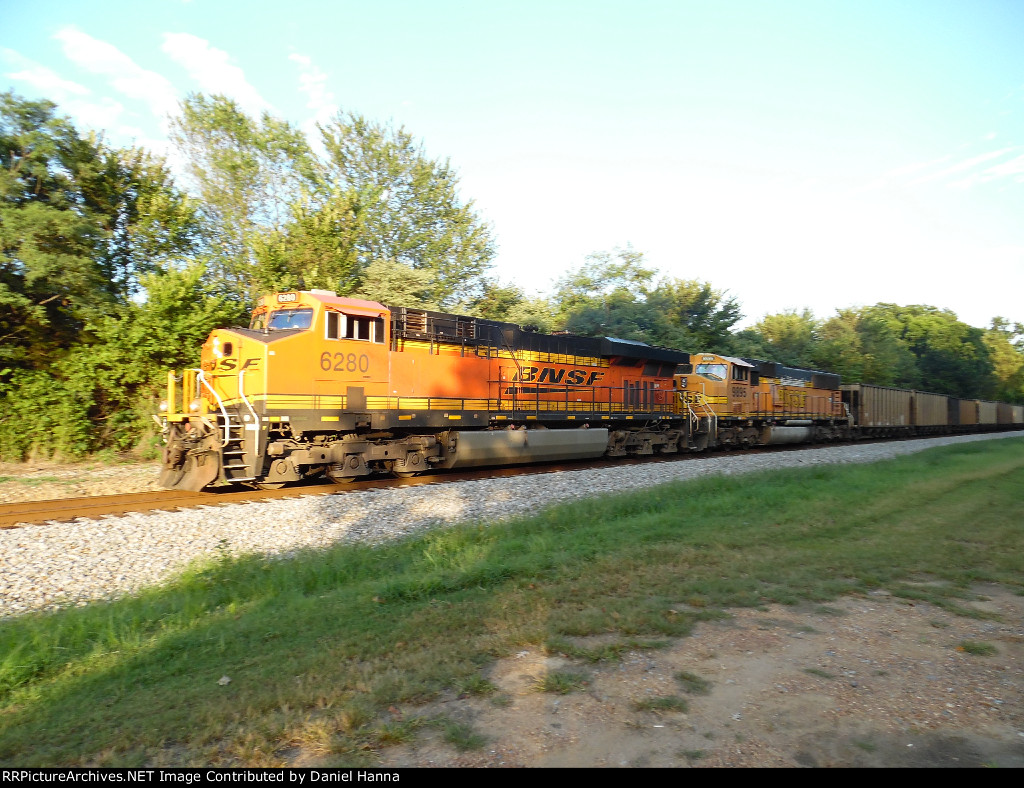 The setting sun lights up NS 735 as it races west